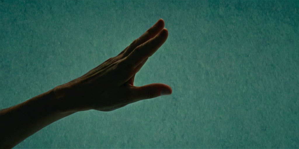 A hand covering the whole screen pointing down as if it had manipulated ...