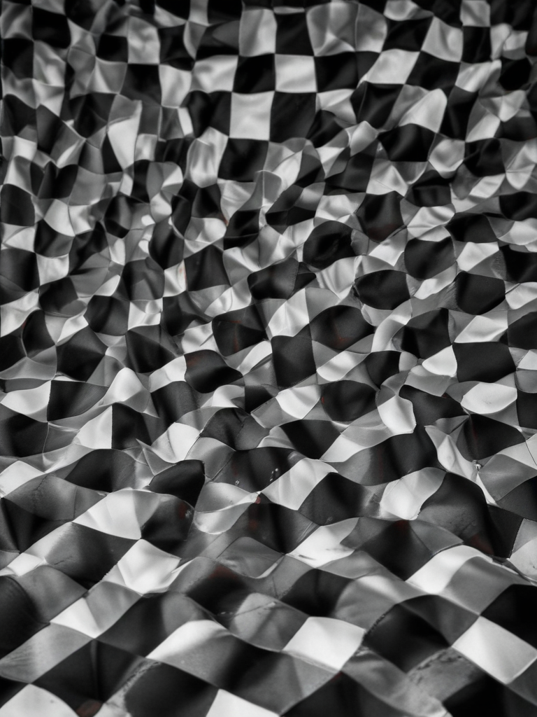 Textured Black and White Checkered Pattern Creating Depth and Movement