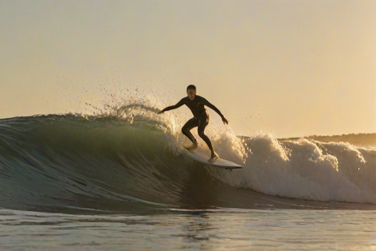 Young Surfer Riding a Majestic Wave at Sunset on the Ocean