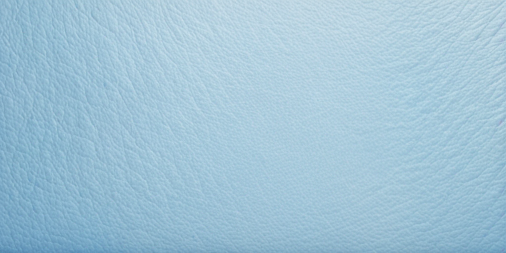 Textured Light Blue Leather Surface with Subtle Patterns and Depth.