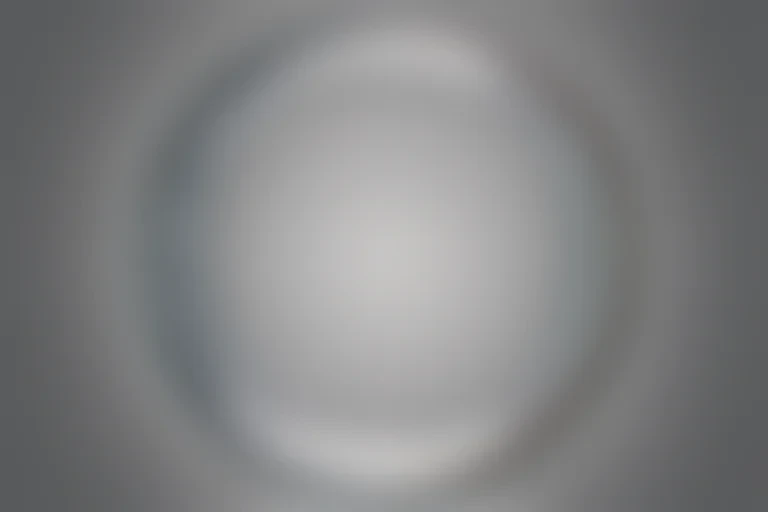 A Glowing Orb in a Softly Lit, Ethereal Background of Gray.