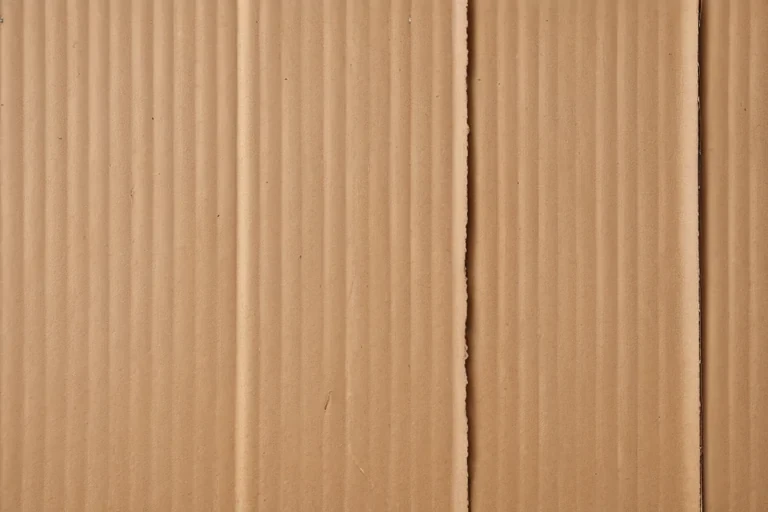 Textured Close-Up of Brown Corrugated Cardboard with Vertical Ridges ...