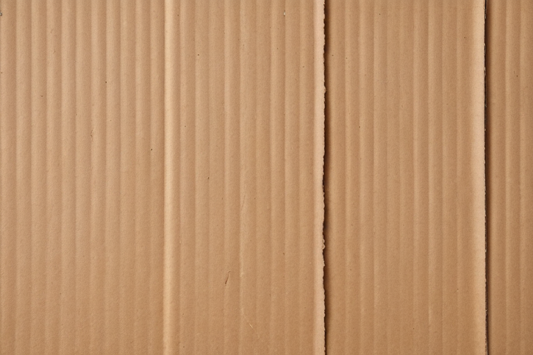 Textured Close-Up of Brown Corrugated Cardboard with Vertical Ridges ...