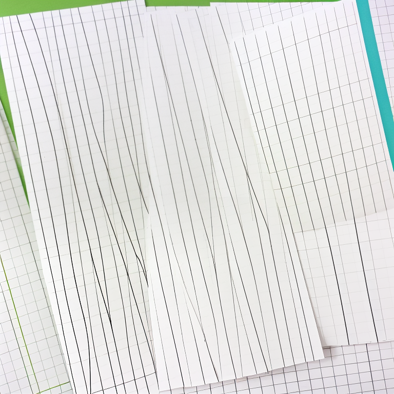 Collection of White Sheets Featuring Grid Patterns and Wavy Lines