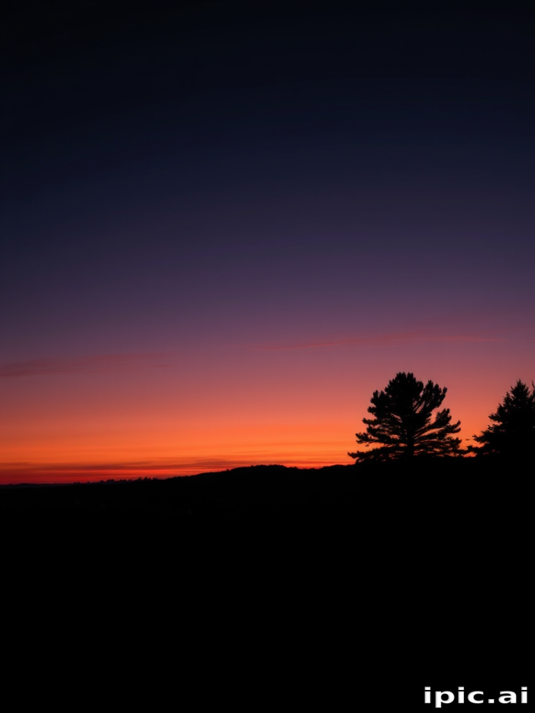 Stunning Twilight Scene with Silhouetted Trees Against a Colorful Horizon