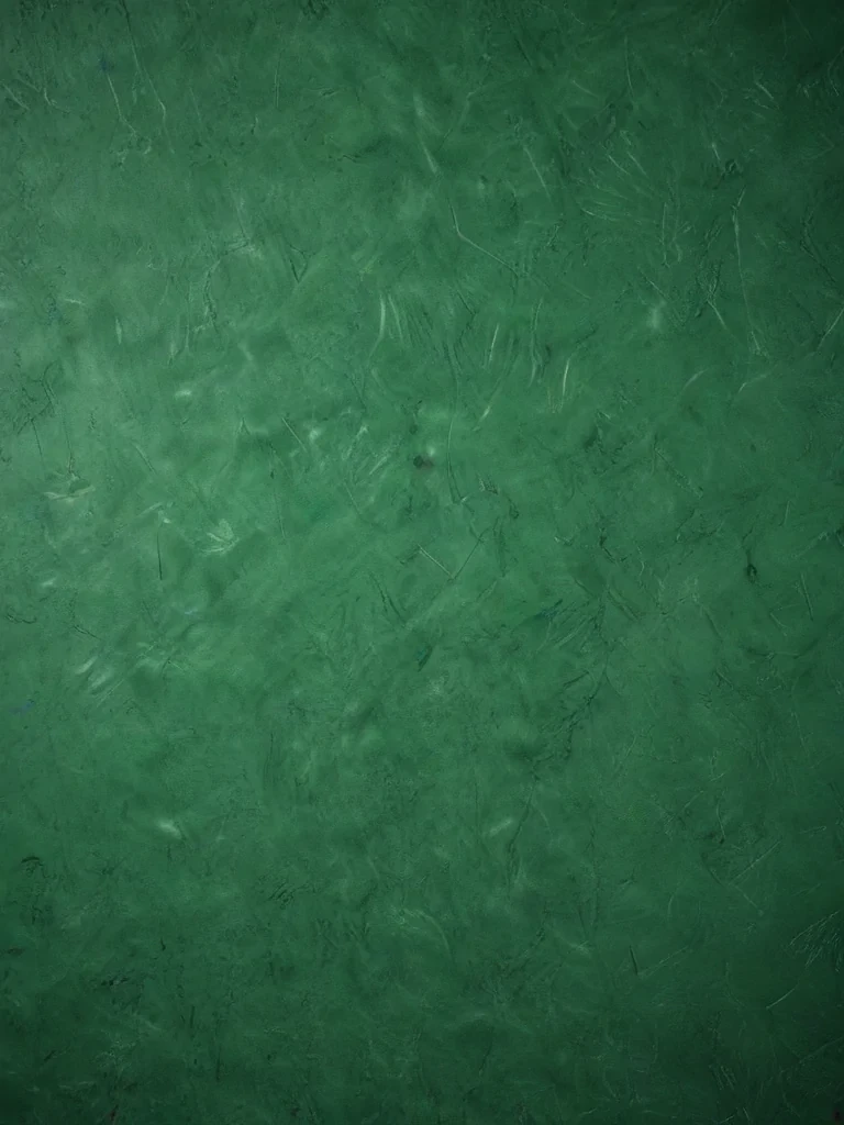 Textured Green Background with Subtle Variations and Depth in Surface