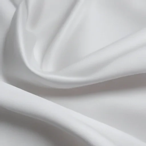 Soft and Luxurious White Fabric Draped Elegantly in Gentle Waves