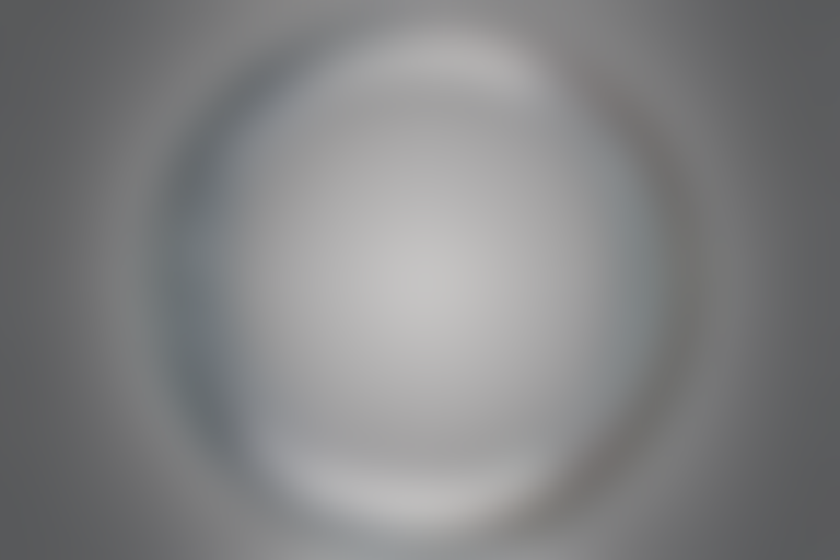 A Glowing Orb in a Softly Lit, Ethereal Background of Gray.