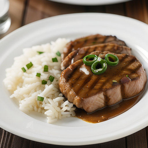 Delicious Grilled Pork Chops Served with Fluffy White Rice and Green Onions