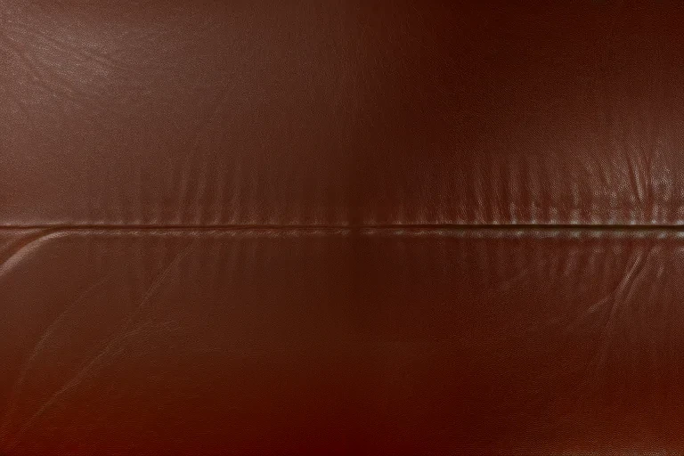 Close-Up of Rich Brown Leather Texture with Subtle Natural Grain Patterns