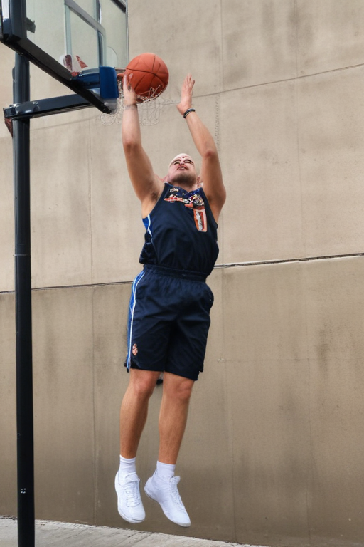 Anthony Giansiracusa who supports the leukaemia foundation dunking a ...