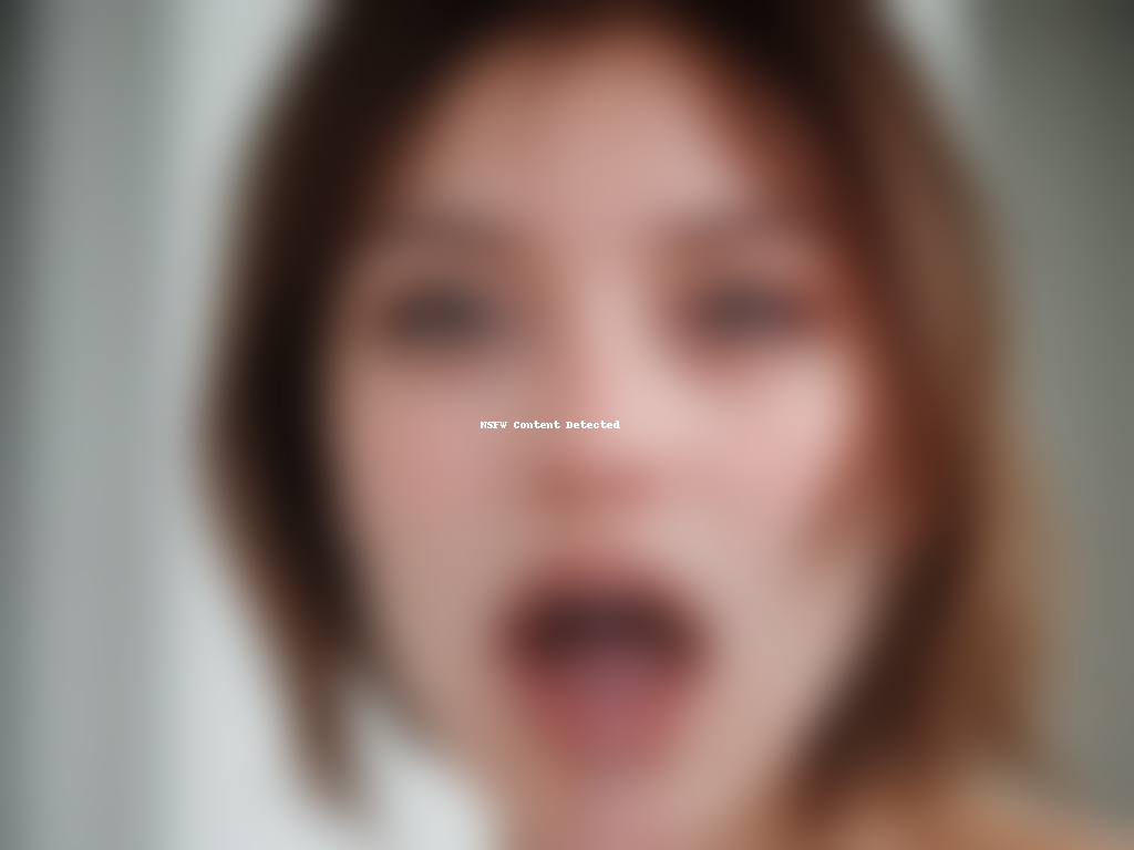 Blurred Expression: A Surprised Reaction Captured in a Moment of Shock