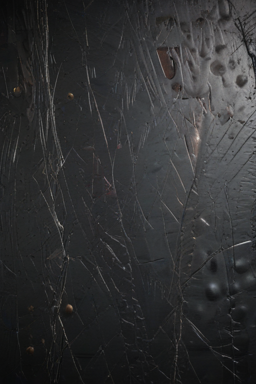 Abstract Texture of Dark Surfaces Featuring Intricate Lines and Patterns