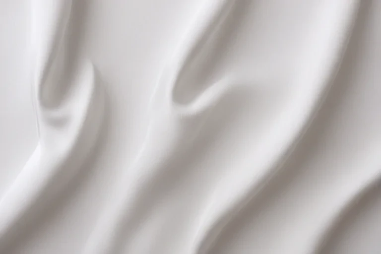 Soft, Flowing White Fabric with Elegant Creases and Subtle Textures